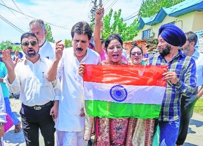 BJP members during a march to celebrate fifth anniversary of abrogation ...